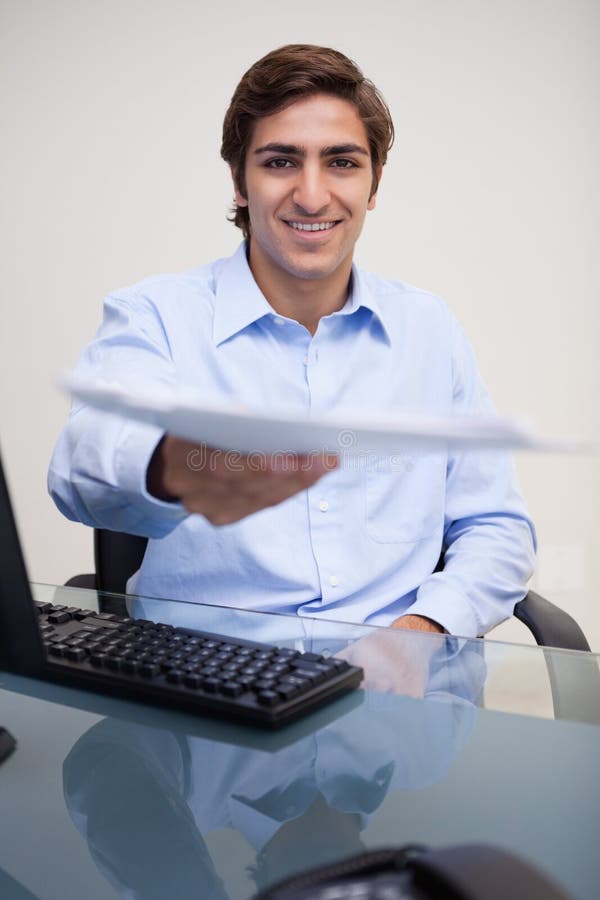 Smiling Businessman Handing Over Paperwork Stock Photo - Image of 2024 ...