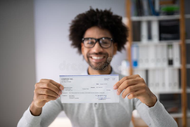 Smiling Businessman Holding Cheque Stock Photo - Image of checkbook ...