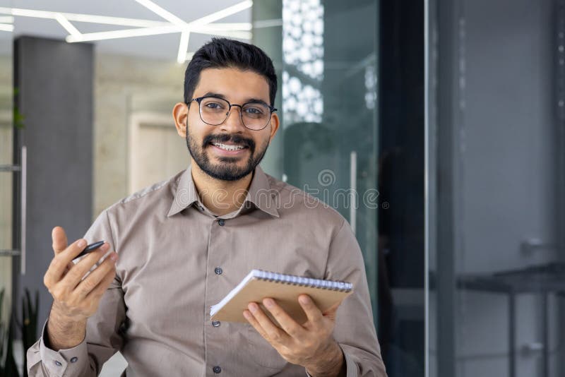 Smiling Businessman Texting on Smartphone in Modern Office Stock Image ...