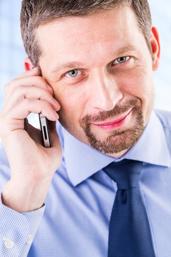 Smiling Businessman Making a Phone Call. Stock Image - Image of looking ...