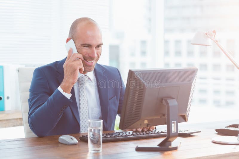 Smiling Businessman on the Phone Stock Image - Image of person, desk ...
