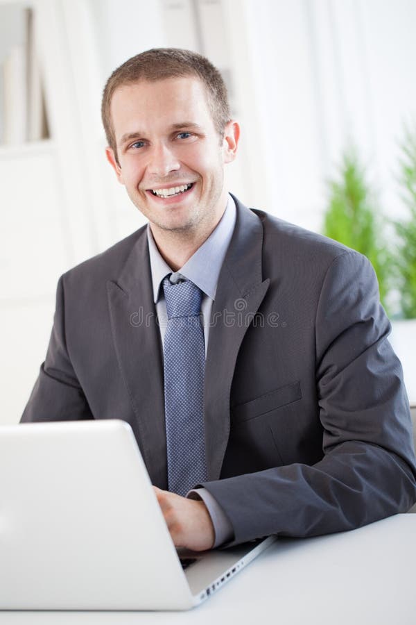 Smiling Businessman Sitting at His Laptop Stock Photo - Image of ... Smiling Businessman Sitting at His Laptop Stock Photo - Image of ...