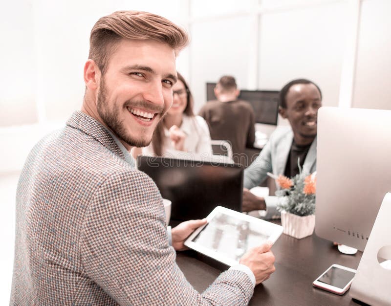 Smiling Businessman Sitting at the Office Desk Stock Photo - Image of ...