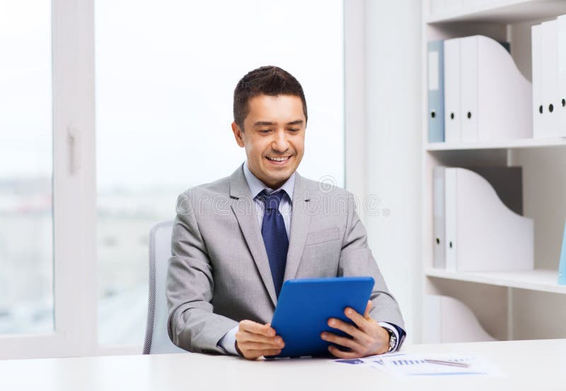 Smiling Businessman with Tablet Pc in Office Stock Photo - Image of ...
