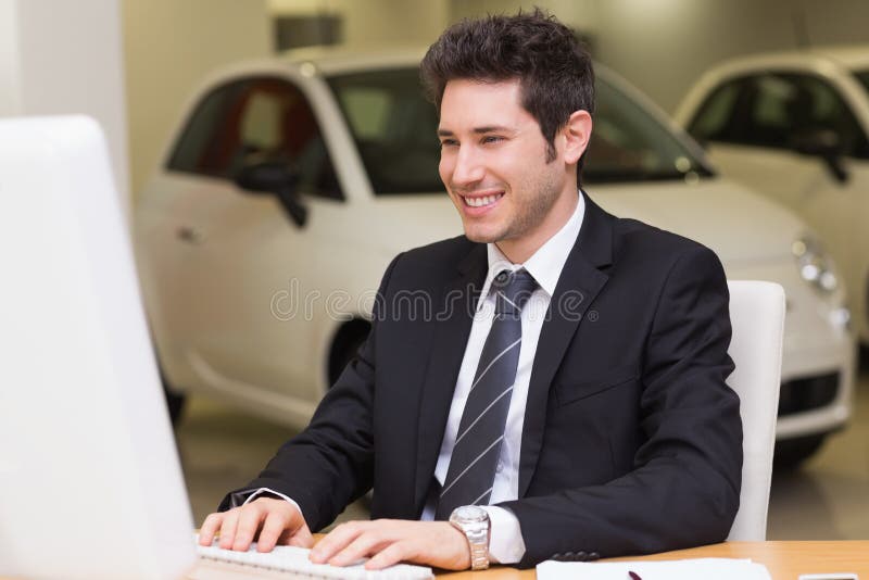 Smiling Businessman Using a Laptop Stock Image - Image of industry ...