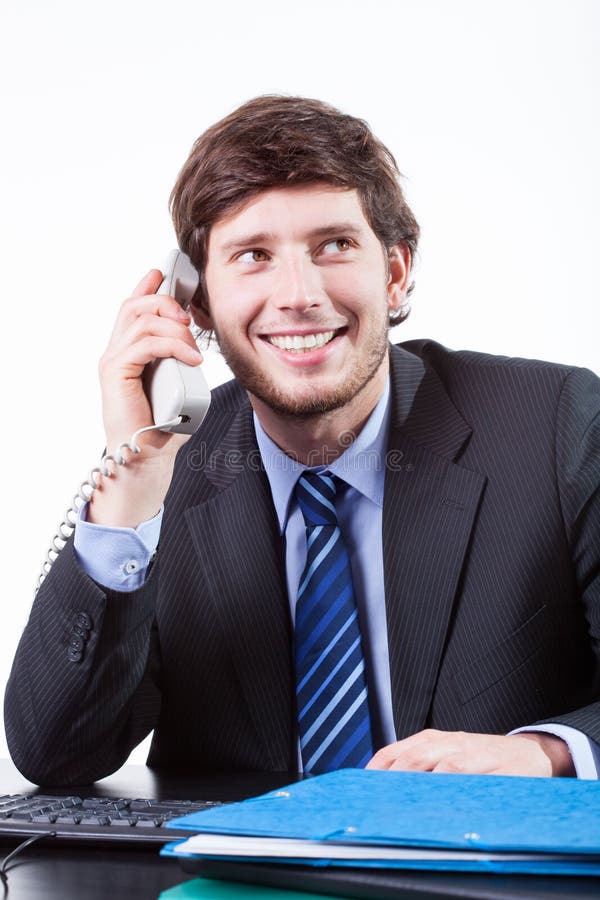 Smiling Businessman Using Phone in Office Stock Photo - Image of ...