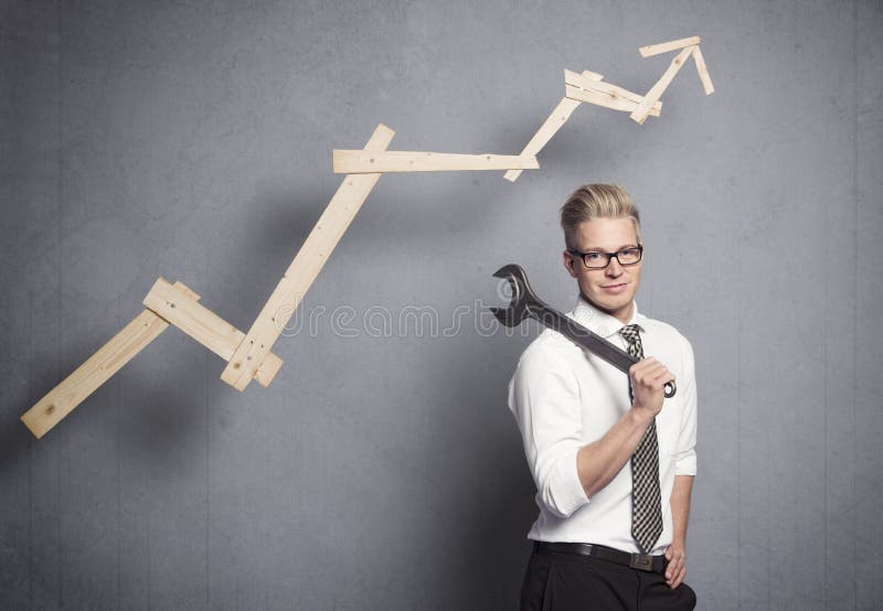 Smiling Businessman with Wrench and Graph. Stock Photo - Image of ...