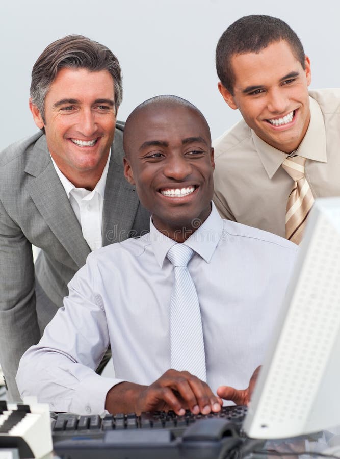 Smiling Businessmen Working at a Computer Stock Image - Image of ...