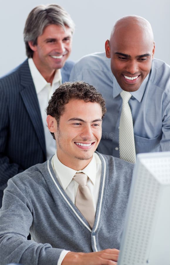Smiling Businessmen Working at a Computer Stock Photo - Image of ...