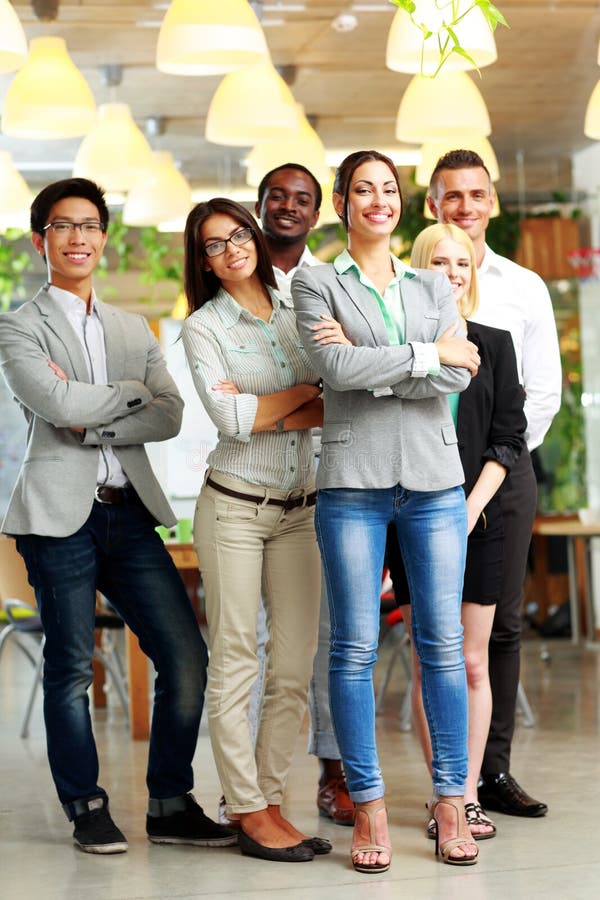 Attractive Young Business Group Standing Together at Office Stock Photo ...