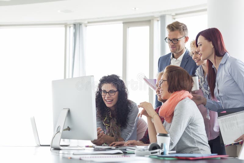 Smiling Businesspeople Working Together at Conference Table Stock Image ...