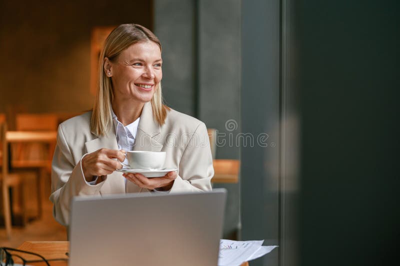 Smiling Businesswoman Having Coffee Break Time during Working Day in ...