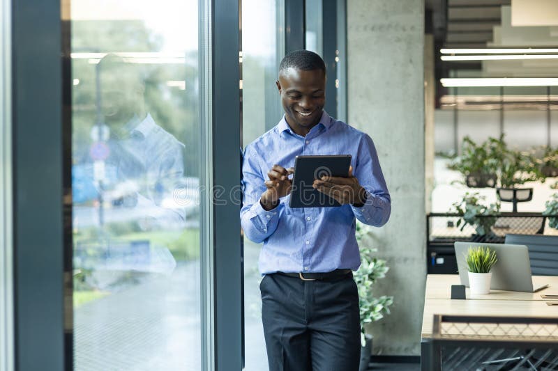 Smiling Busy African Businessman Manager Using Tablet Computer Standing ...