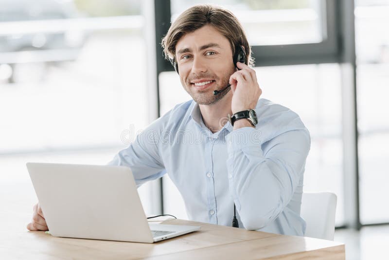 Smiling Call Center Worker with Laptop Looking at Camera while Sitting ...