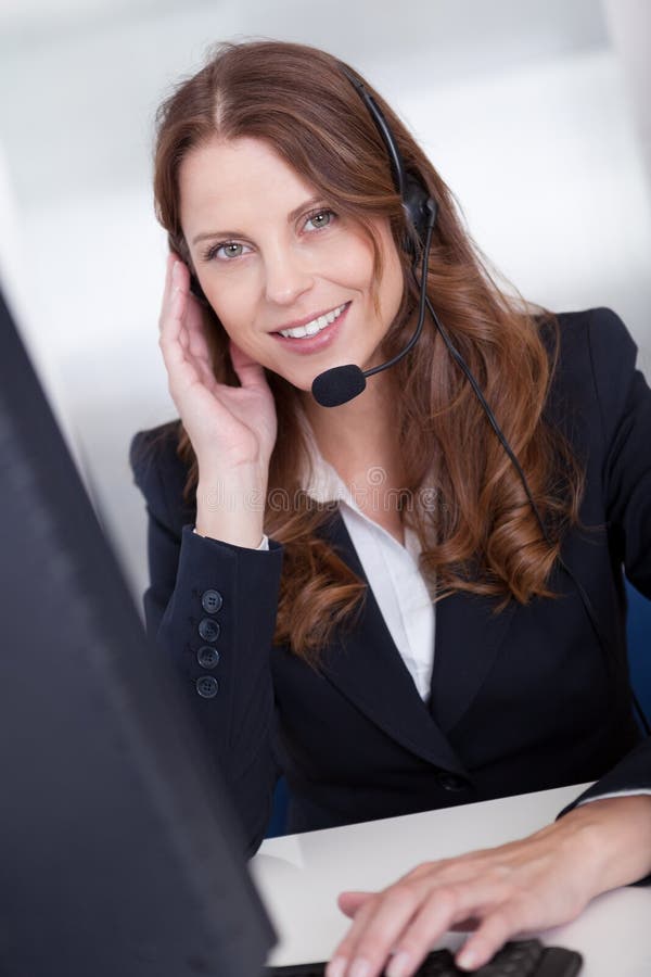 Smiling Call Center Worker Sitting Typing Stock Image - Image of ...