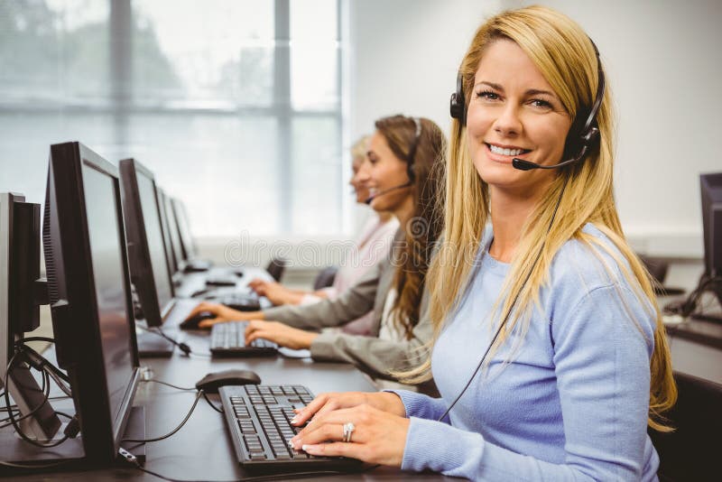 Smiling Call Centre Agent Talking on the Headset Stock Photo - Image of ...