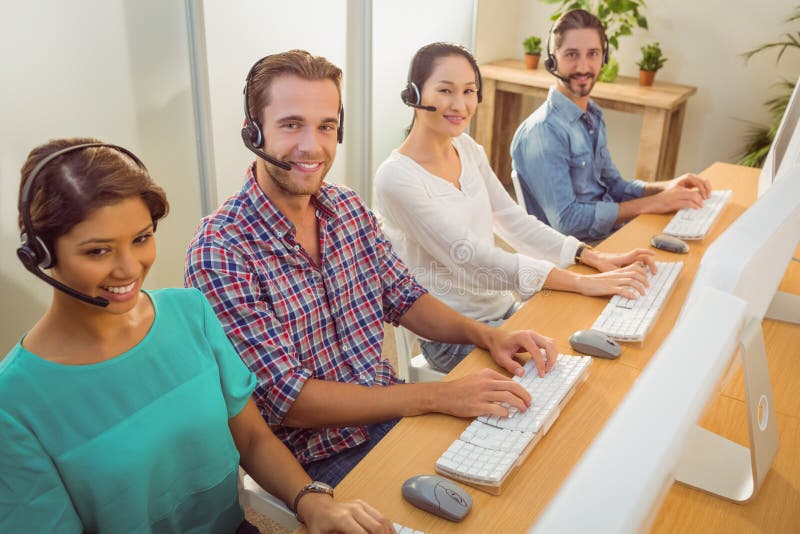 Smiling Call Centre Team Looking at the Camera Stock Photo - Image of ...
