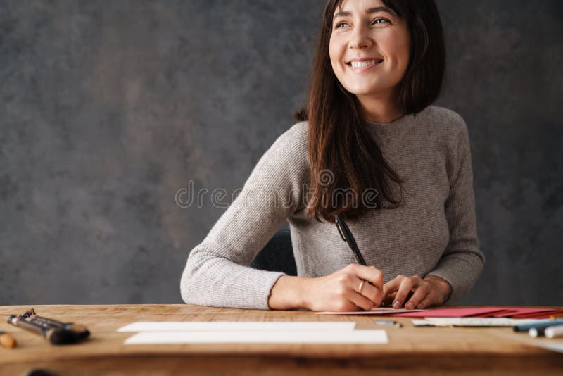 Smiling Calligrapher Girl Writing while Working at Table Stock Image ...