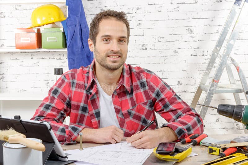 Smiling Carpenter Sitting at the Desk, in His Studio Stock Photo ...