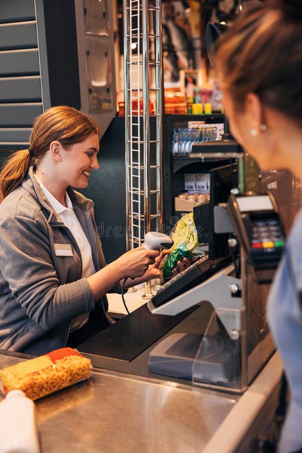 Smiling Cashier Using a Barcode Scanner on a Salad Pack Stock Photo ...
