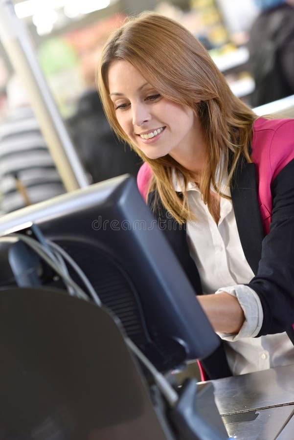 Smiling Cashier Processing Credit Card Paymen Stock Photo - Image of ...