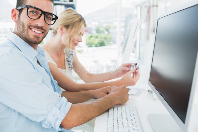 Smiling Casual Young Couple Working on Computer Stock Image - Image of ...