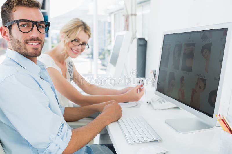 Smiling Casual Young Couple Working on Computer Stock Image - Image of ...