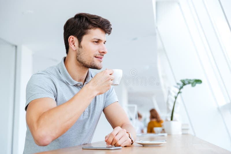 Positive Smiling Man Drinking Coffee Stock Photo - Image of beverage ...