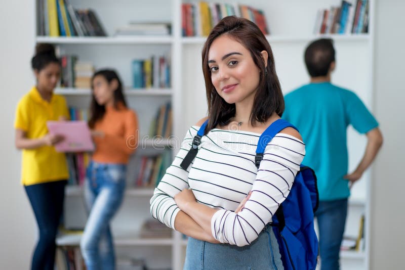 Smiling Caucasian Female Student with Group of Students Stock Photo ...