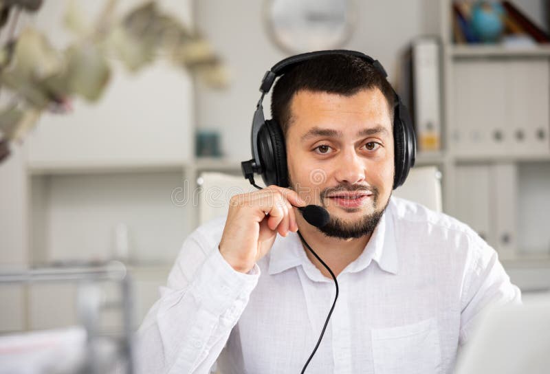 Smiling Man with Headset in His Workplace in Office Stock Image - Image ...