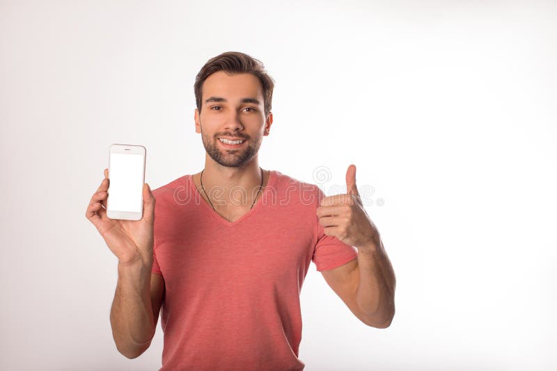 Smiling Cheerful Caucasian Man In Pink T Shirt Showing Hand Sign Well
