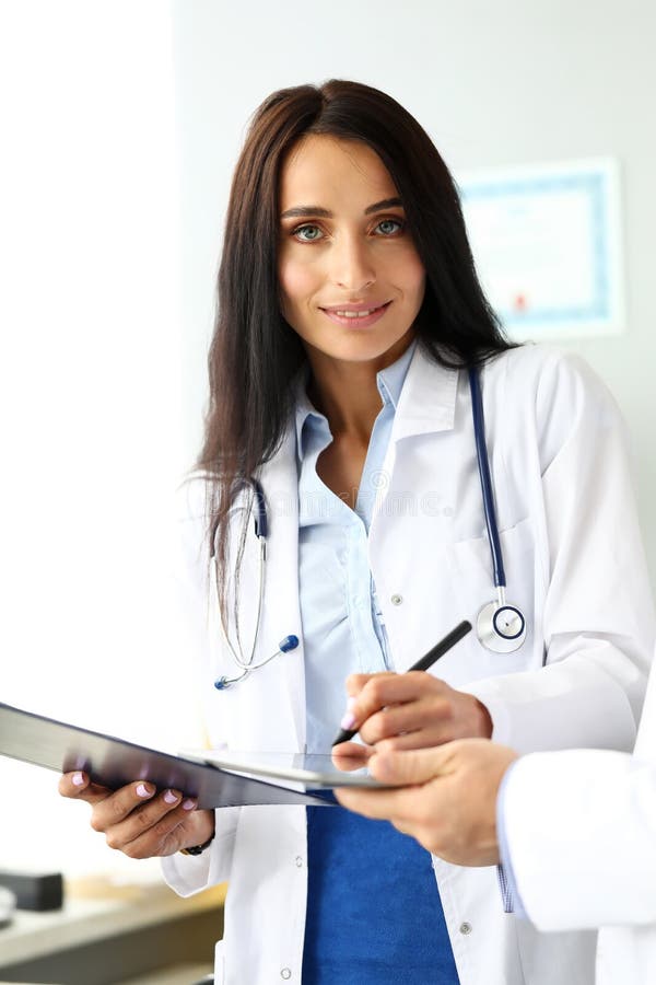 Smiling Cheerful Female GP Making Electronic Notes Stock Image - Image ...