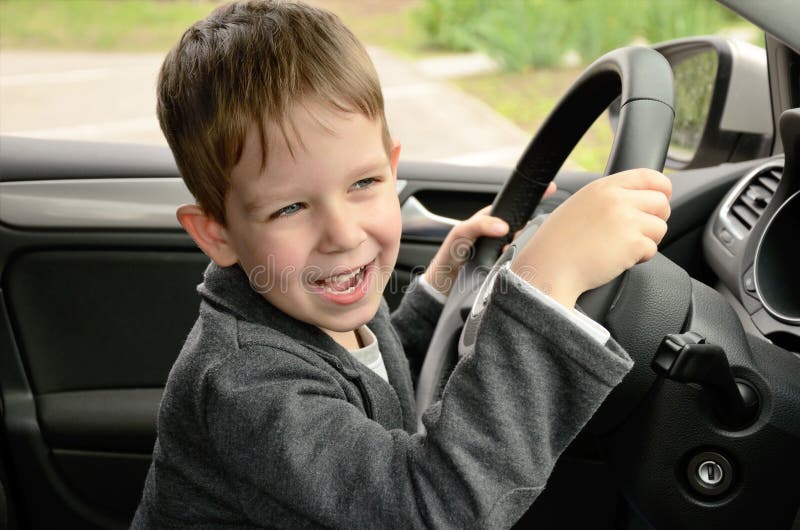 Smiling Cheerful Little Boy Driving Stock Photo - Image of child ...