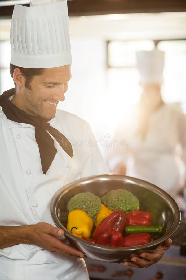 Smiling Chef Showing Bowl of Vegetable Stock Photo - Image of expertise ...