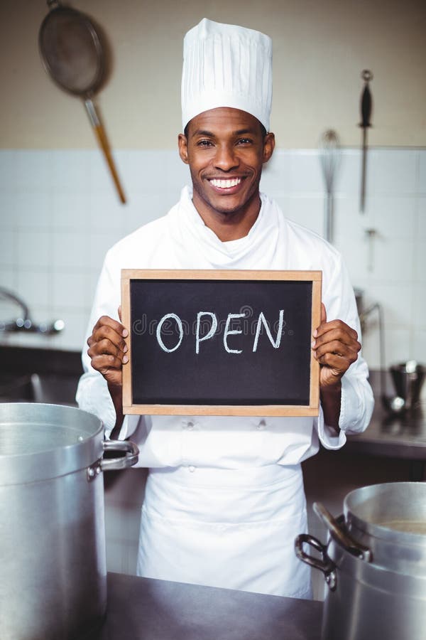 Smiling Chef Showing Chalkboard with Open Sign Stock Image - Image of ...