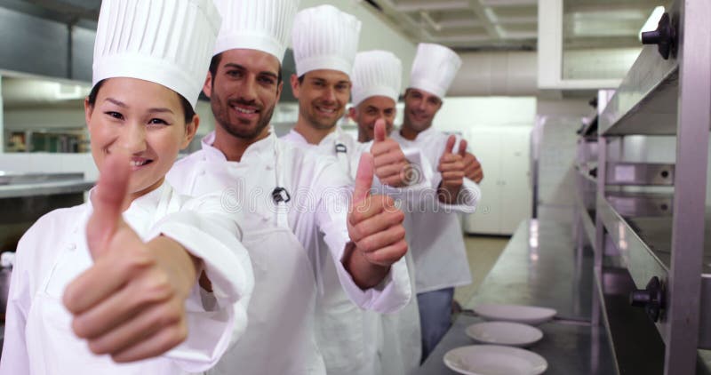 Smiling Chefs Standing in a Row Giving Thumbs Up Stock Footage - Video ...
