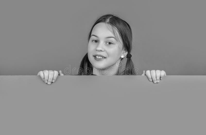 Smiling Child Behind Blank Orange Paper with Copy Space for ...