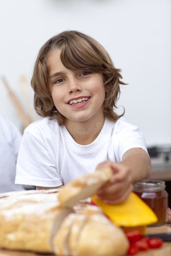 Smiling child eating bread stock photo. Image of meal - 11662810