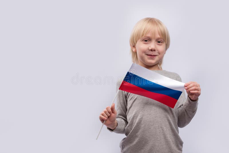 Smiling Child Holds a Russian Flag. Learning Russian for Kids Stock ...