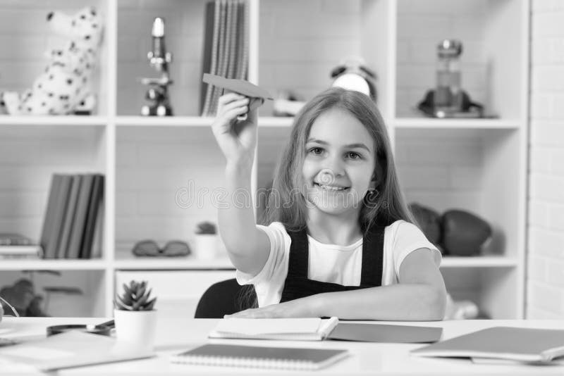 Smiling Child Play with Paper Plane in School Classroom Stock Photo ...