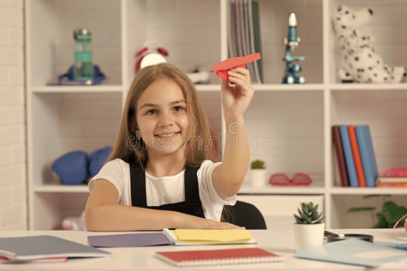 Smiling Child Play with Paper Plane in School Classroom Stock Photo ...