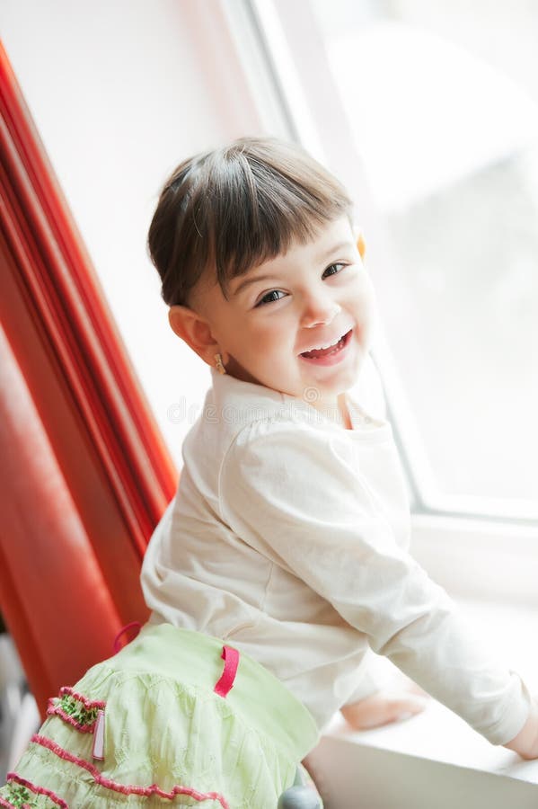 Smiling Child Sitting at the Window. Stock Image - Image of cheerful ...
