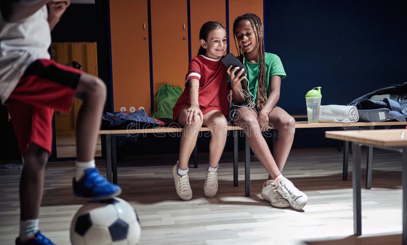 .Children Sitting in a Changing Room and Talking Stock Photo - Image of ...