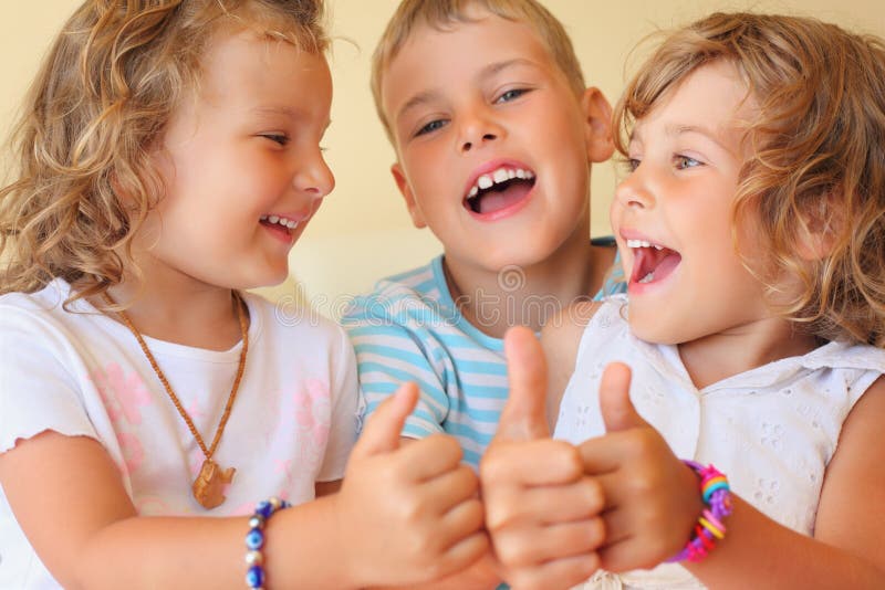 Smiling Children Three Together Shows Ok Gesture Stock Photo - Image of ...