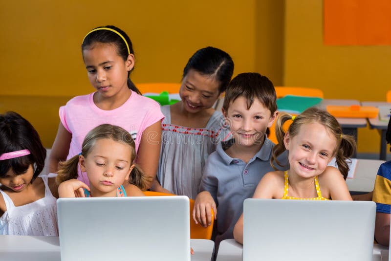 Smiling Children Using Laptops Stock Image - Image of group, academic ...