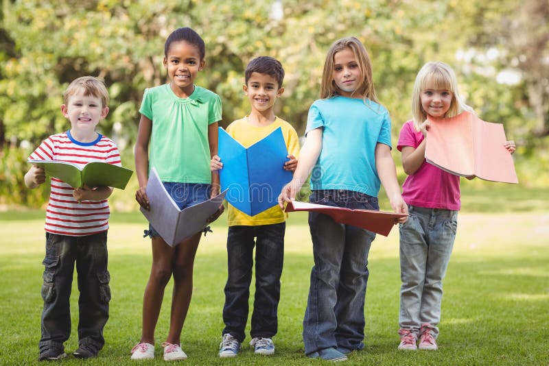 Smiling Classmates Holding Notepads Stock Image - Image of posing ...