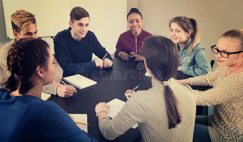 Smiling Classmates Having Difficult Project To Complete during Class ...