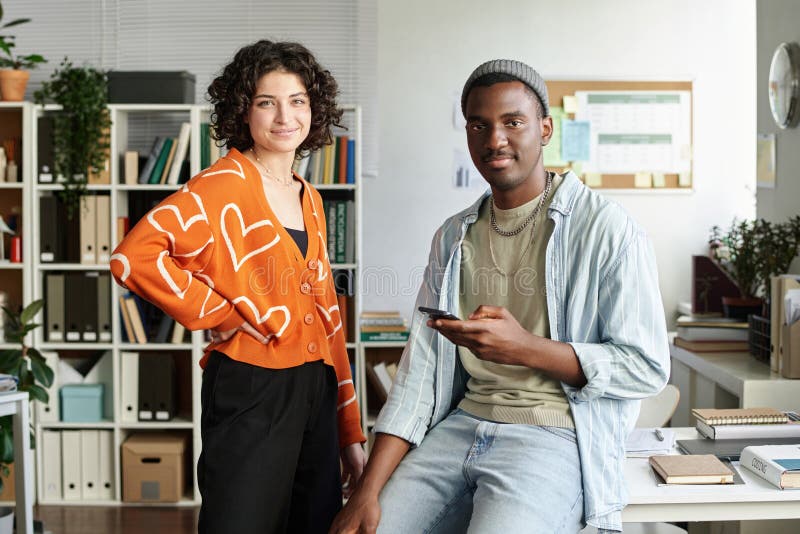 Smiling Colleagues Collaborating in Modern Office Setting Stock Image ...