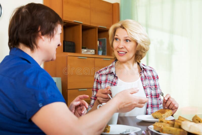 Smiling Colleagues Drinking Tea and Chatting during Coffee Break Stock ...