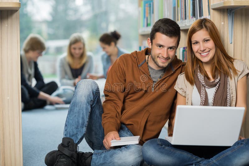 Smiling College Students with Laptop in Library Stock Photo - Image of ...